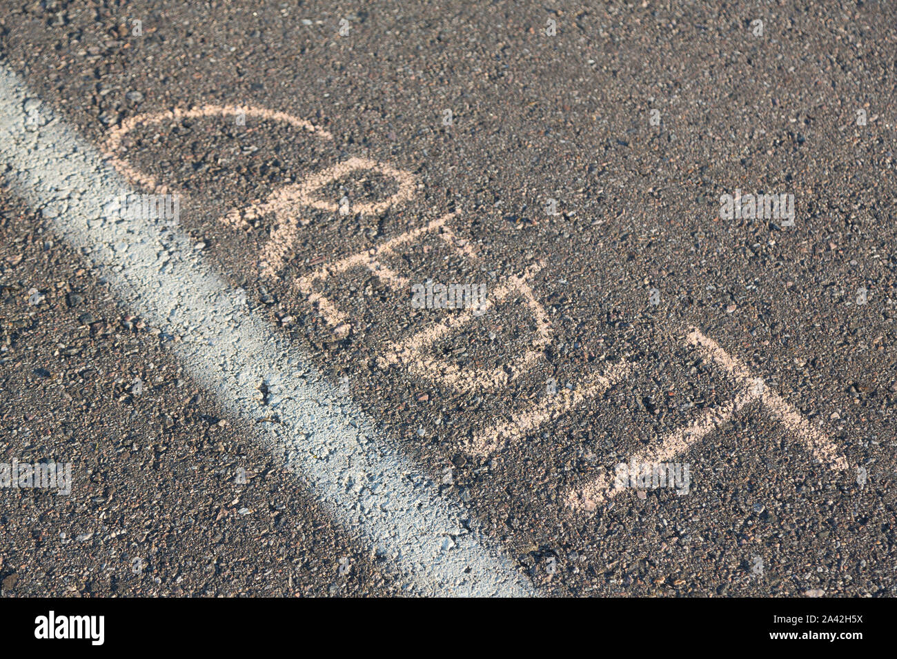 Credit text on a asphalt Stock Photo - Alamy