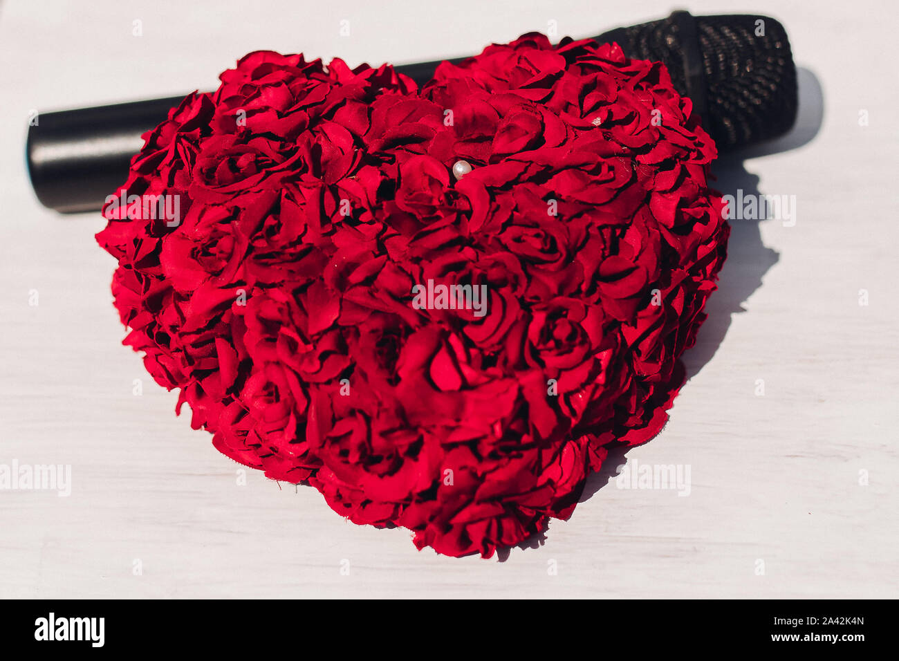 Close-up of wedding decoration made of bright red roses and a black ...
