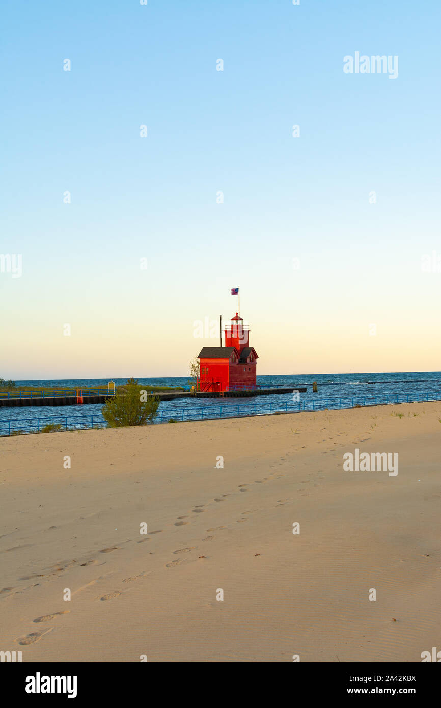 Beautiful sunrise at Holland State Park beach with view of Big Red ...