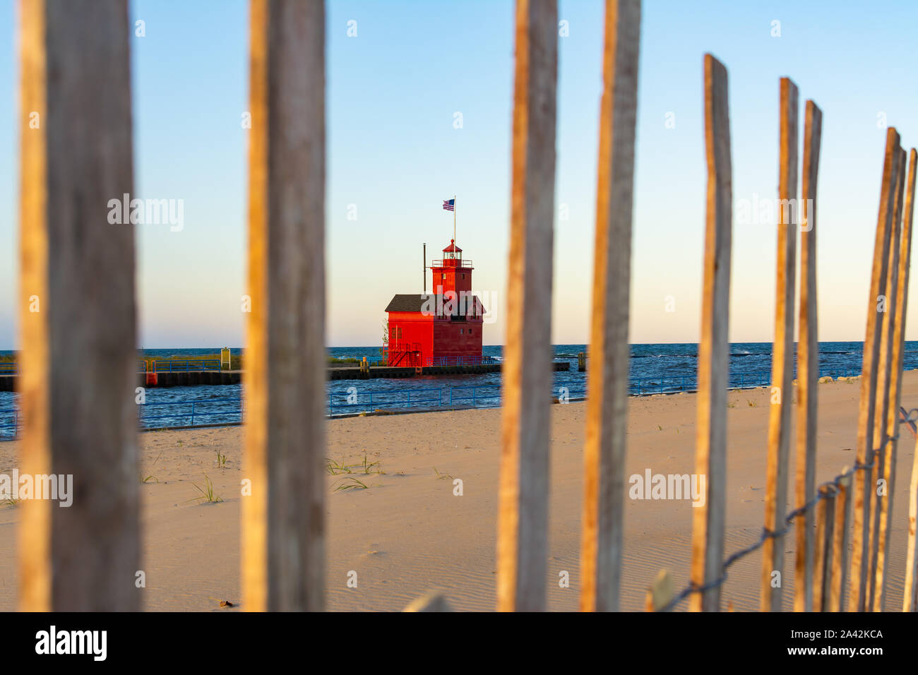 Beautiful sunrise at Holland State Park beach with view of Big Red ...