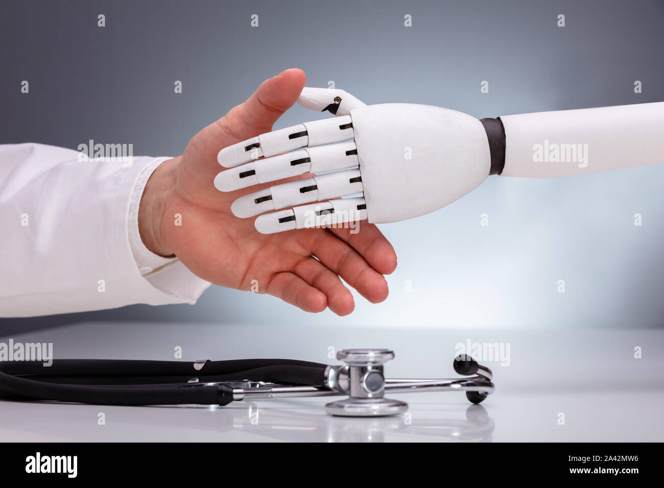 Human robot hand shaking hi-res stock photography and images - Alamy