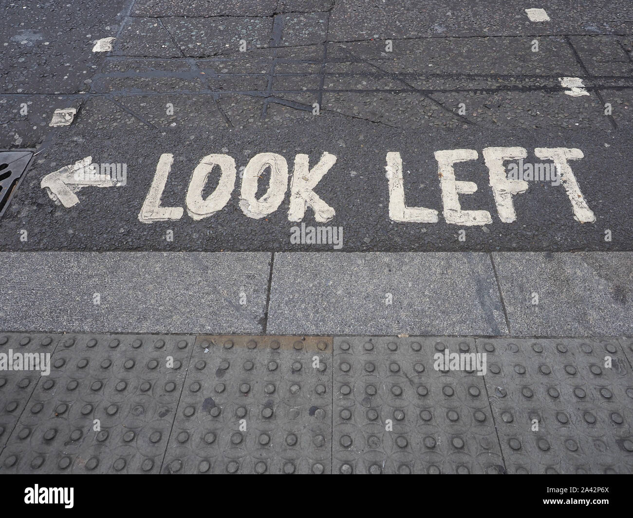 Look Left traffic sign on a London street tarmac Stock Photo - Alamy