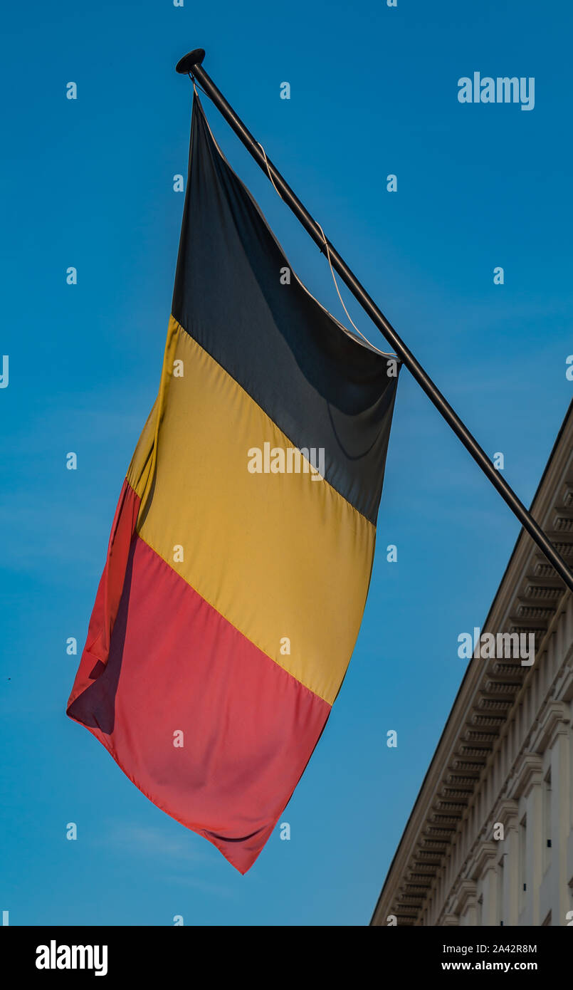 A picture of the Belgian flag on the facade of a building in the Place ...