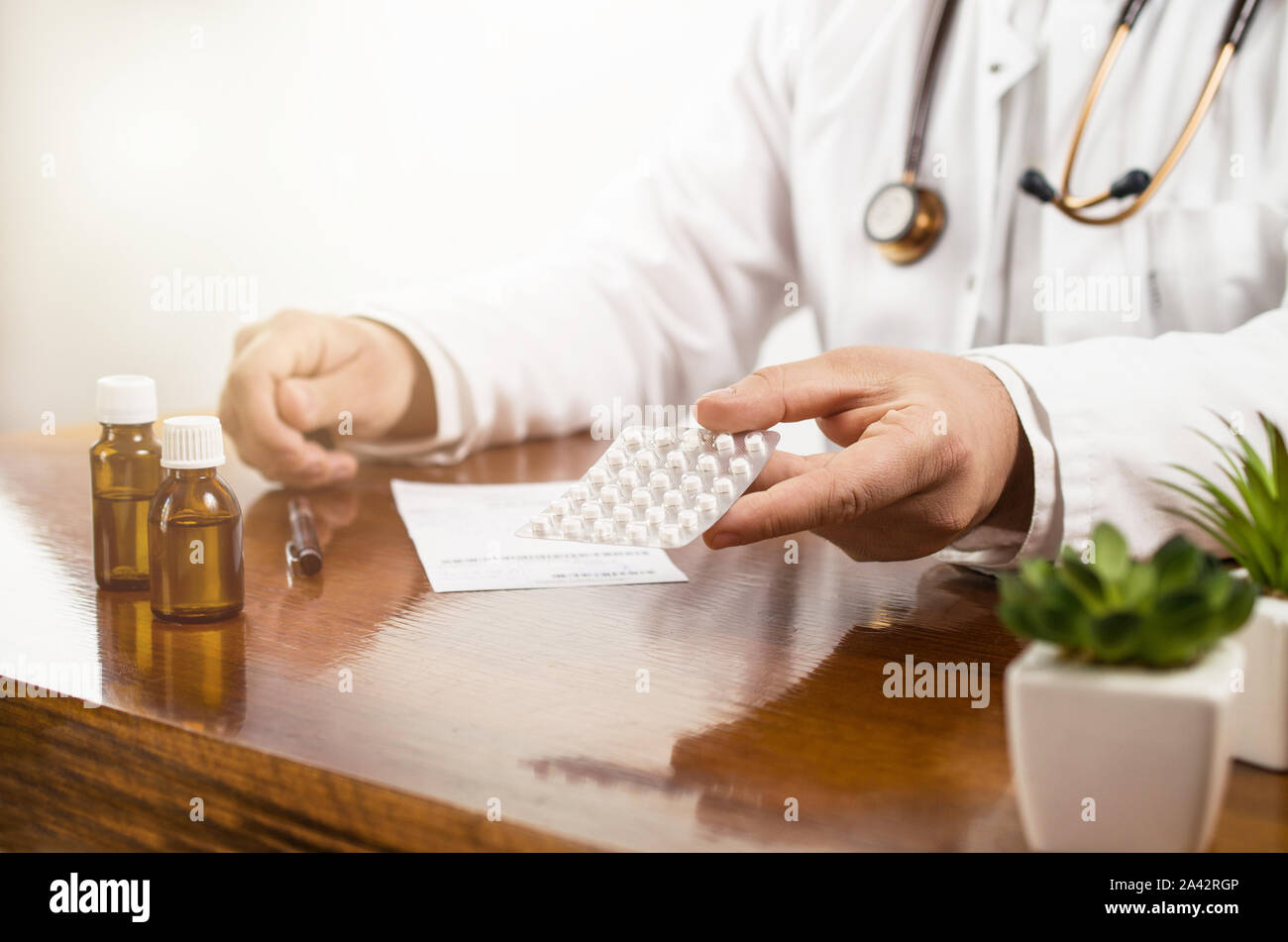 Doctor hand giving medicine patient hi-res stock photography and images ...