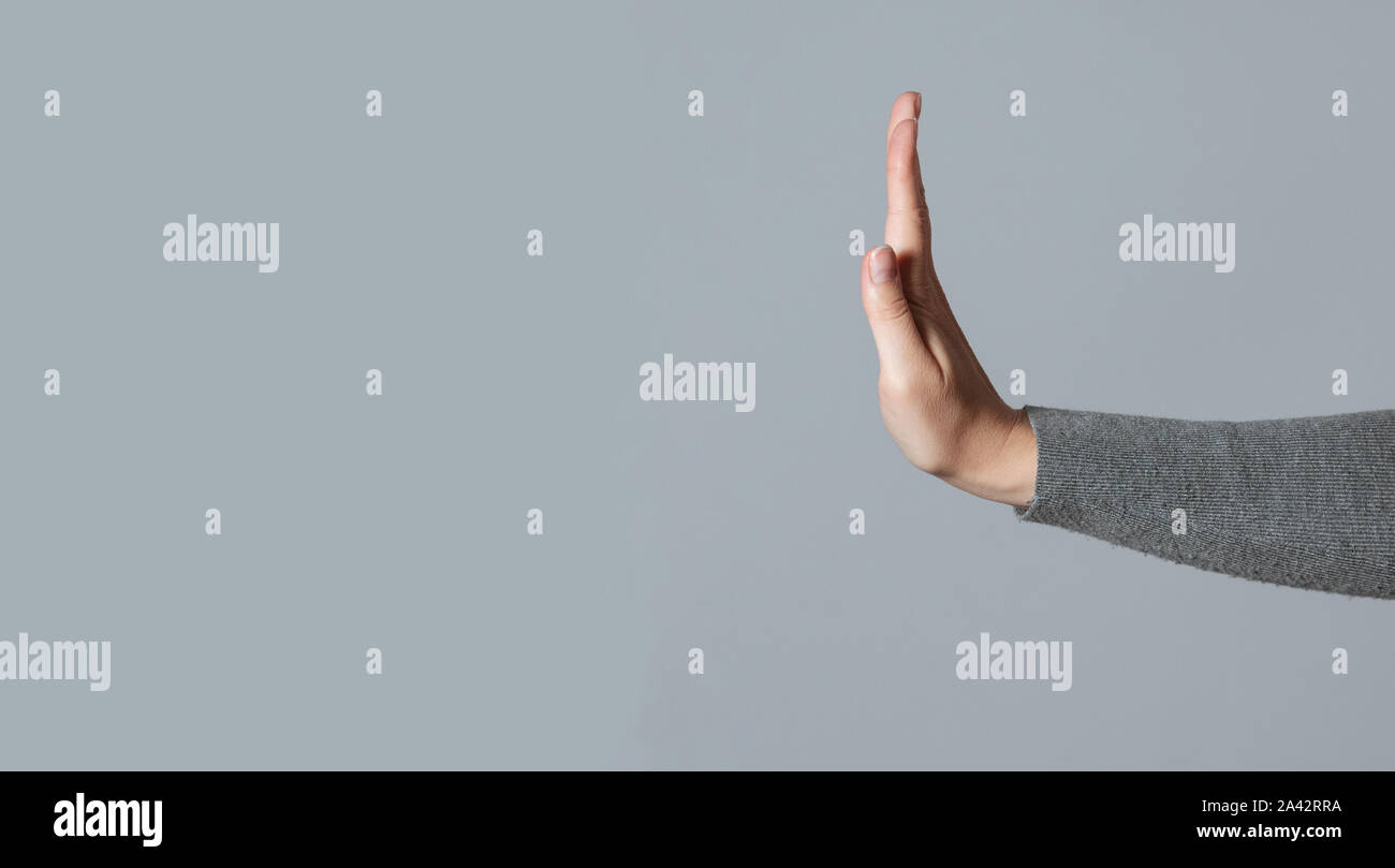 Woman showing a refuse hand gesture sign Stock Photo - Alamy