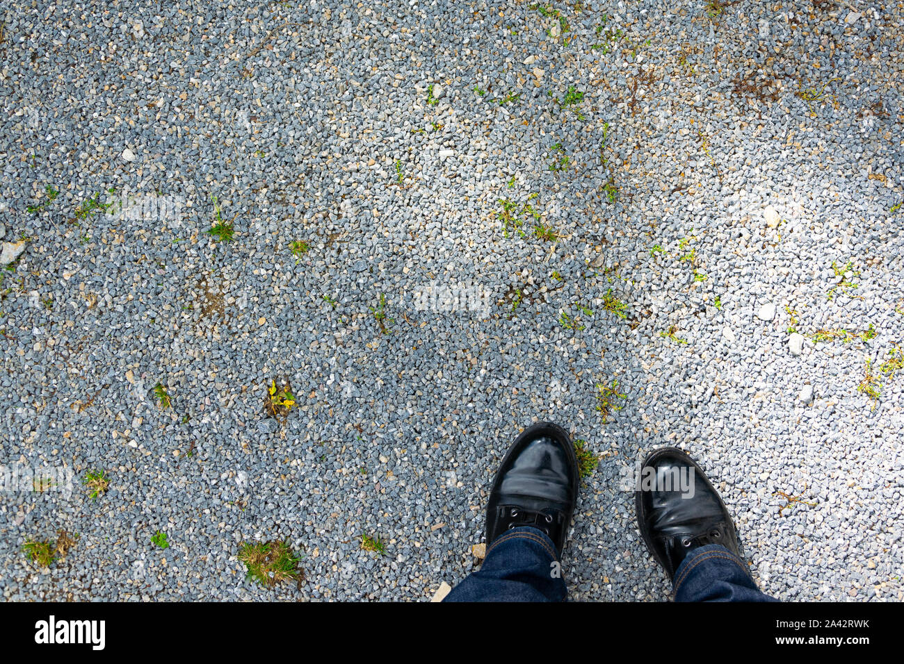 Personal point of view of person standing on pebbles ground, space for ...