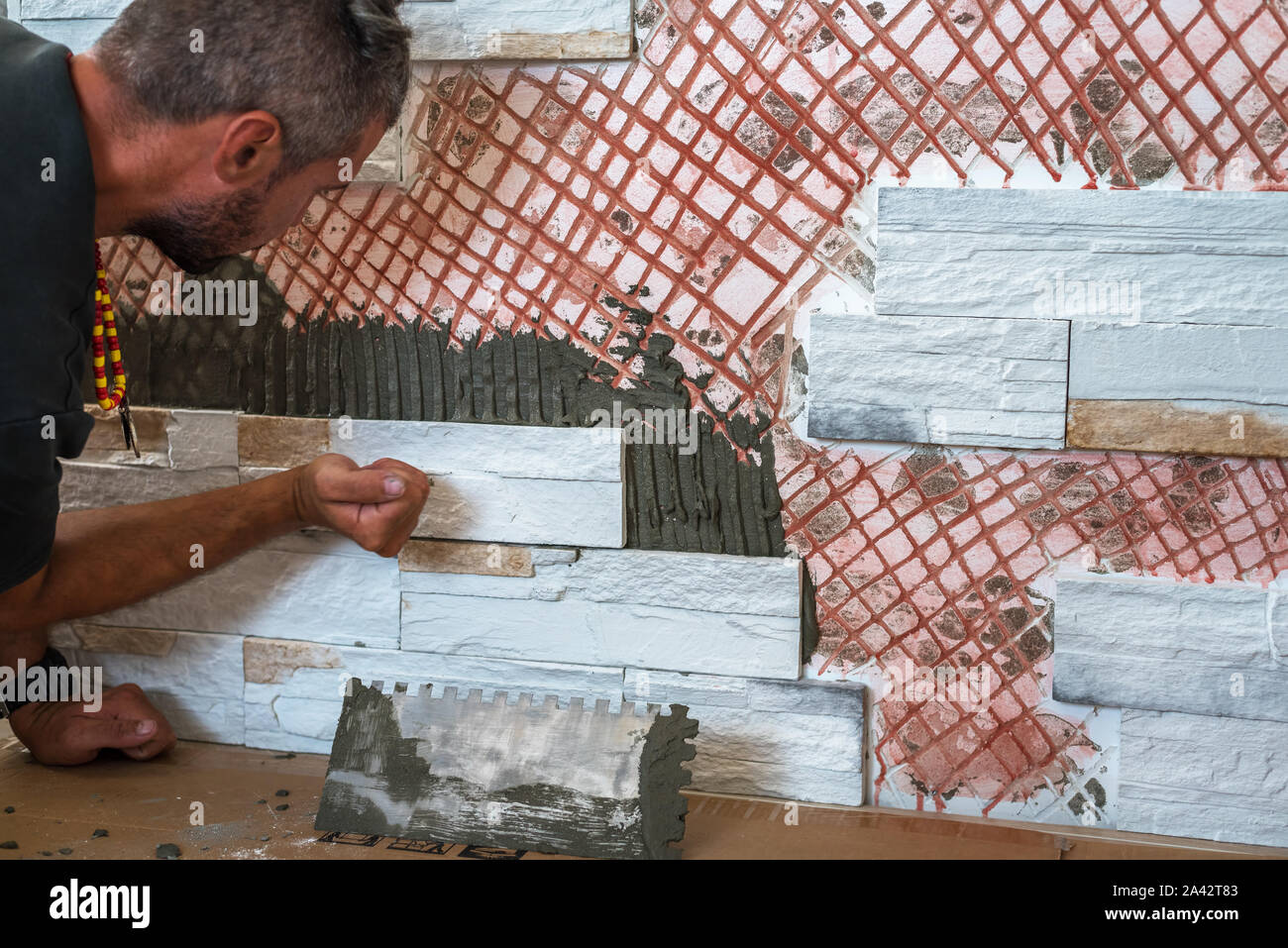 Installing new tiles hi-res stock photography and images - Alamy