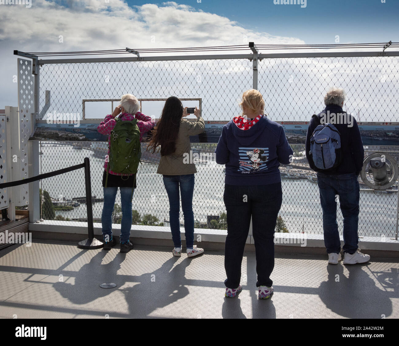 Tourists enjoy the view from the top of the A'DAM Lookout, a tower ...
