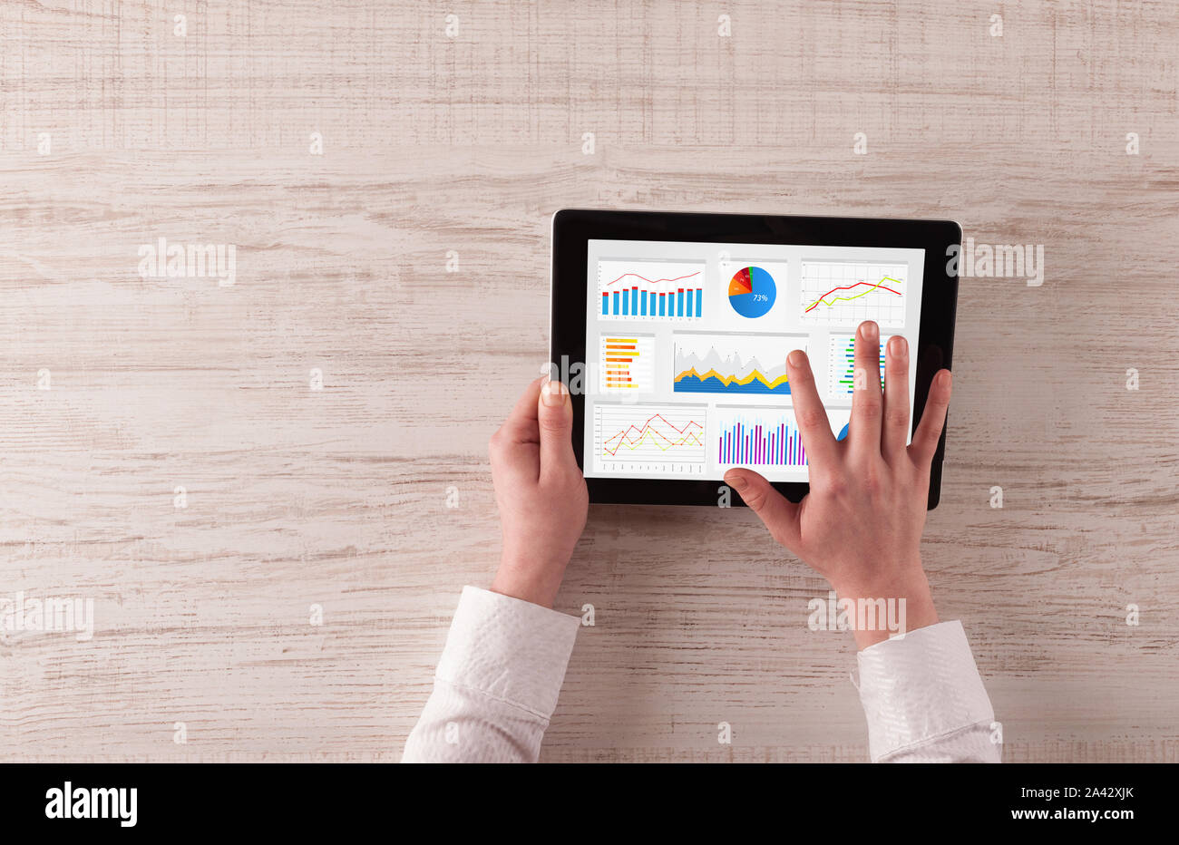 Hand making diagrams and charts on tablet Stock Photo - Alamy