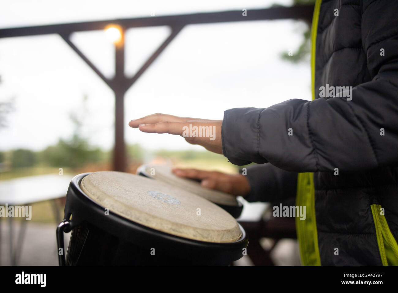 Child playing bongo drums hi-res stock photography and images - Alamy