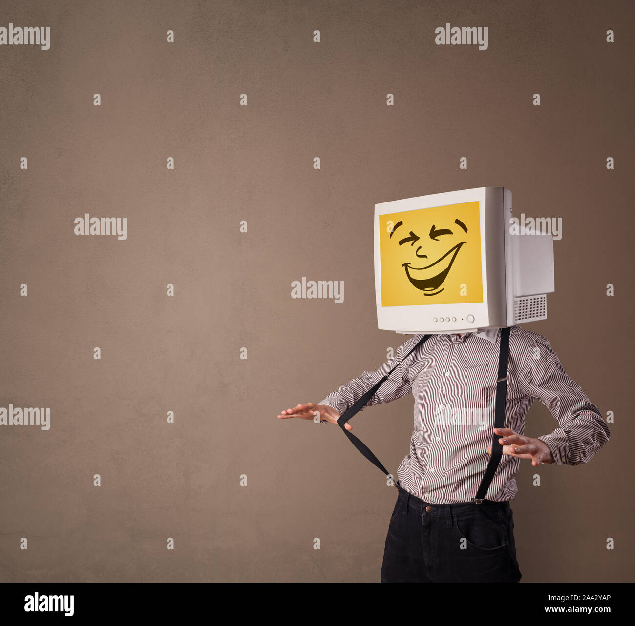 Young person with happy smiley monitor head Stock Photo - Alamy