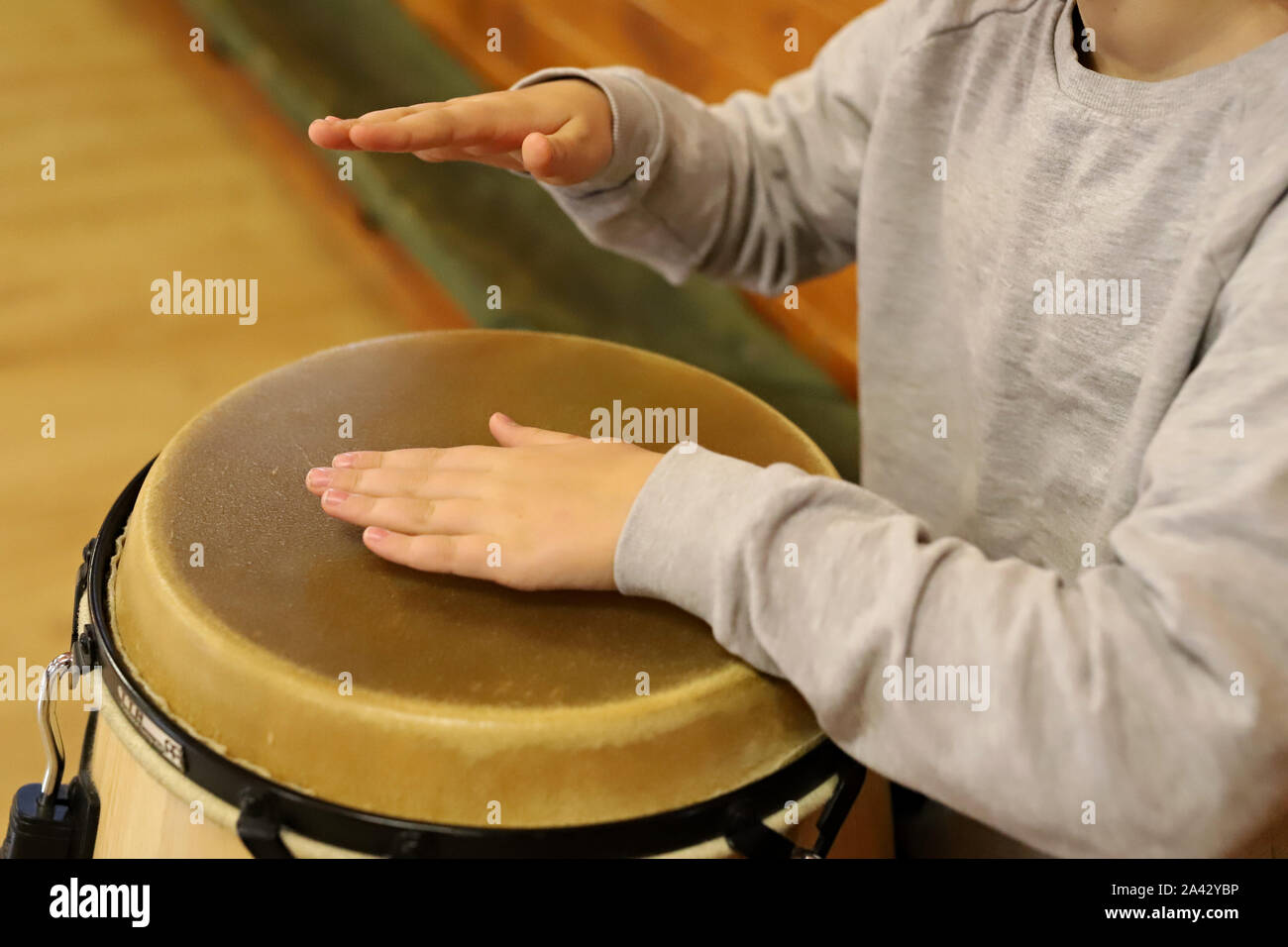 Child playing bongo drums hi-res stock photography and images - Alamy