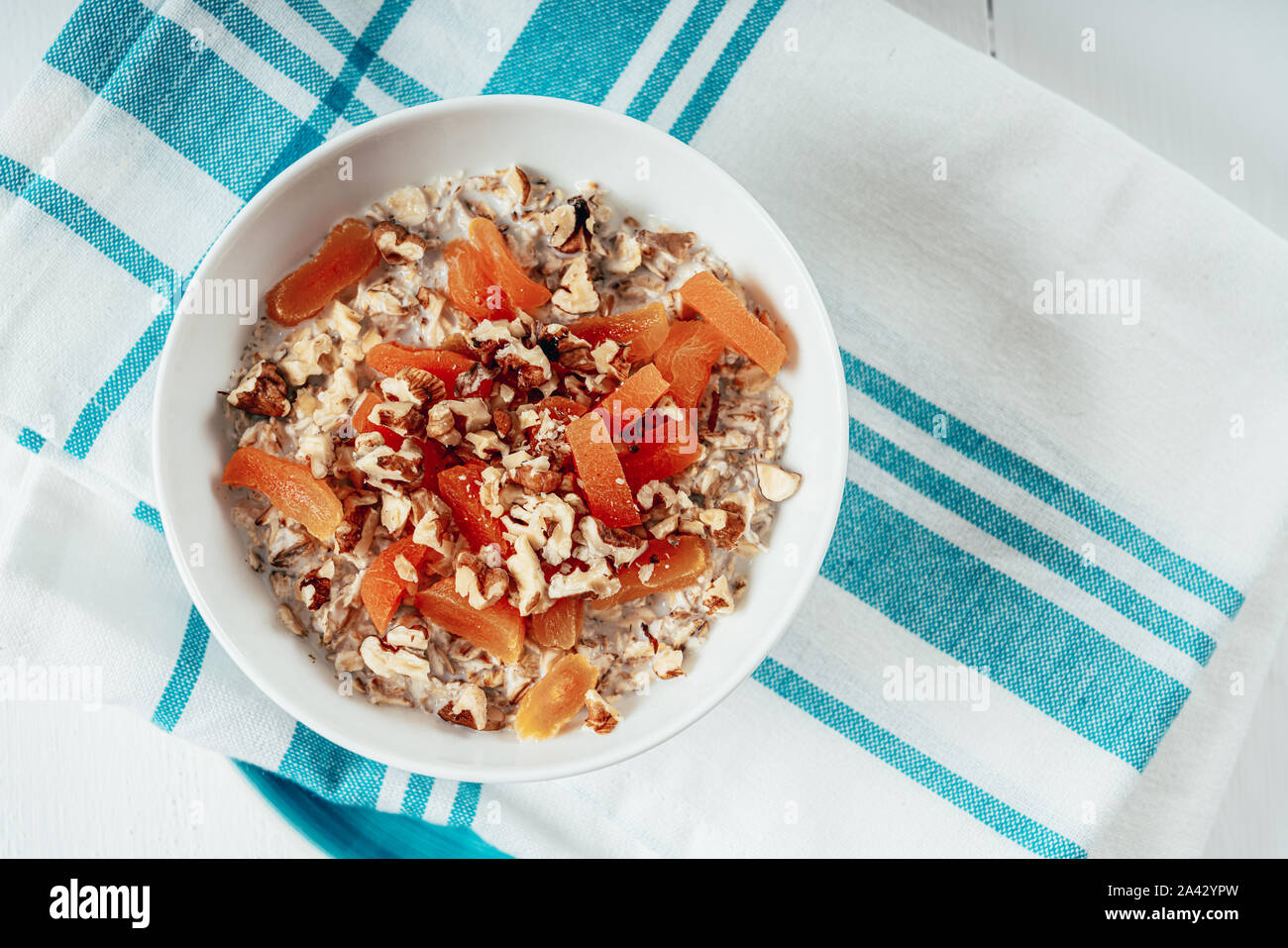 Spiced Apricot And Walnuts Porridge With Oats Stock Photo - Alamy