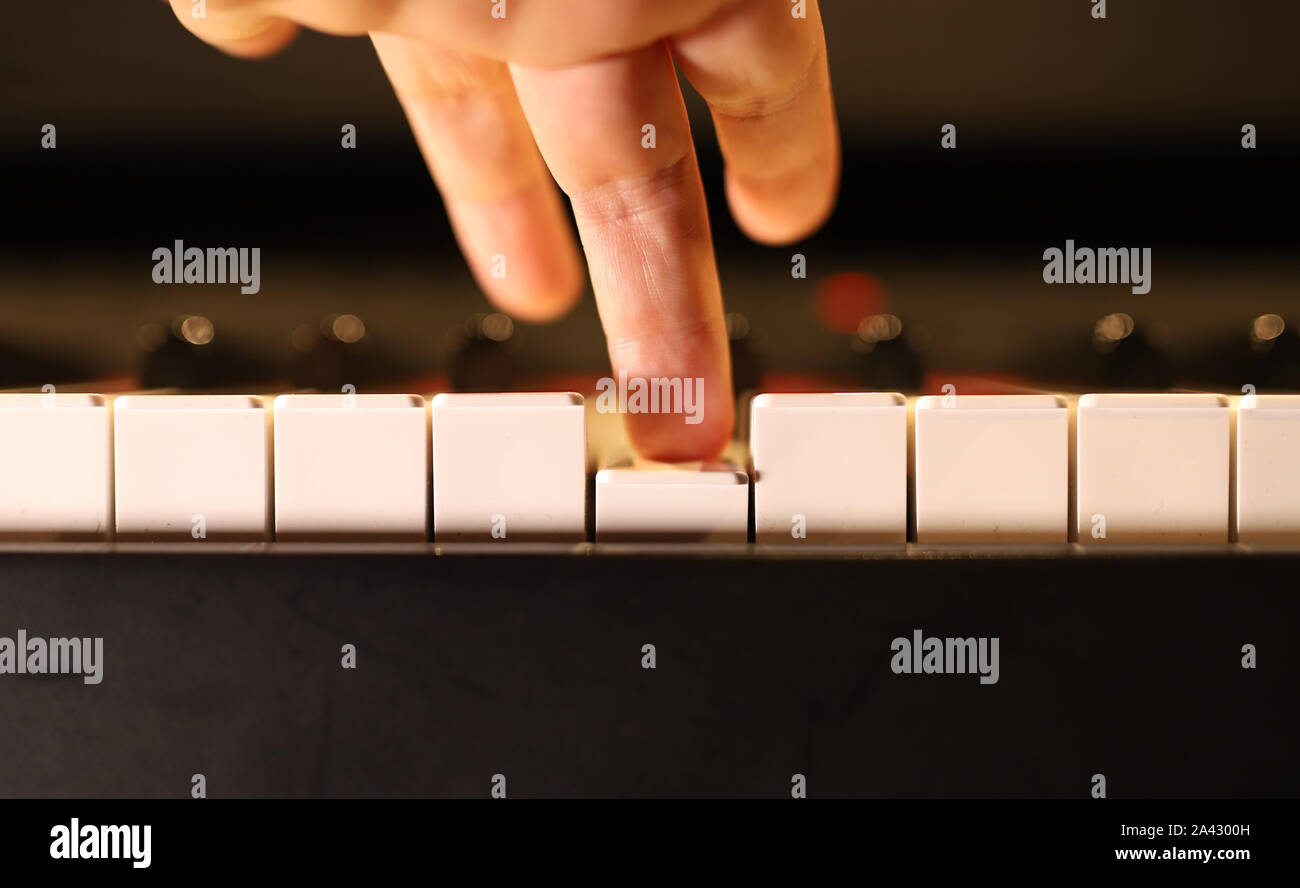 electric piano, hand playing on the keyboard, fingers on the keys Stock ...