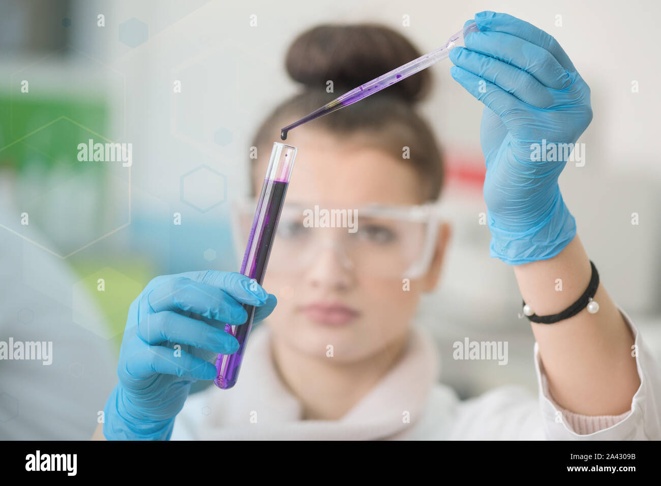 Young Female Laboratory scientist working at lab with test tubes, test ...