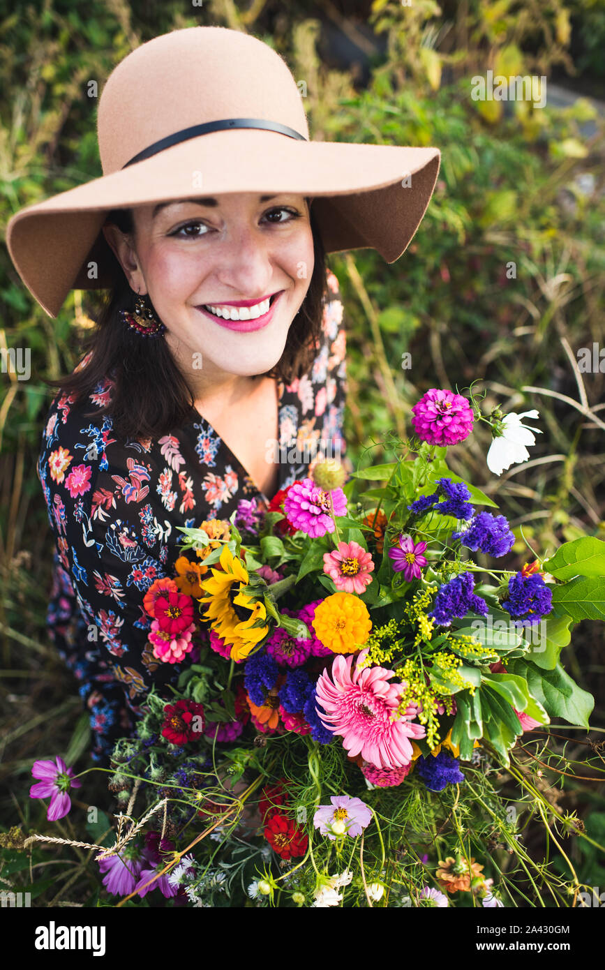 happy woman working in an urban garden Stock Photo - Alamy