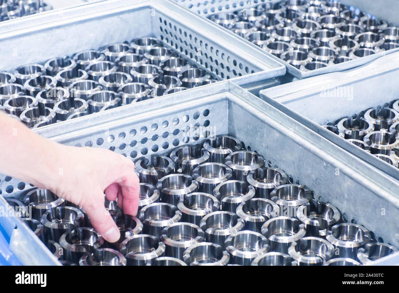 technician hand holding tools in grinding shop working Stock Photo - Alamy