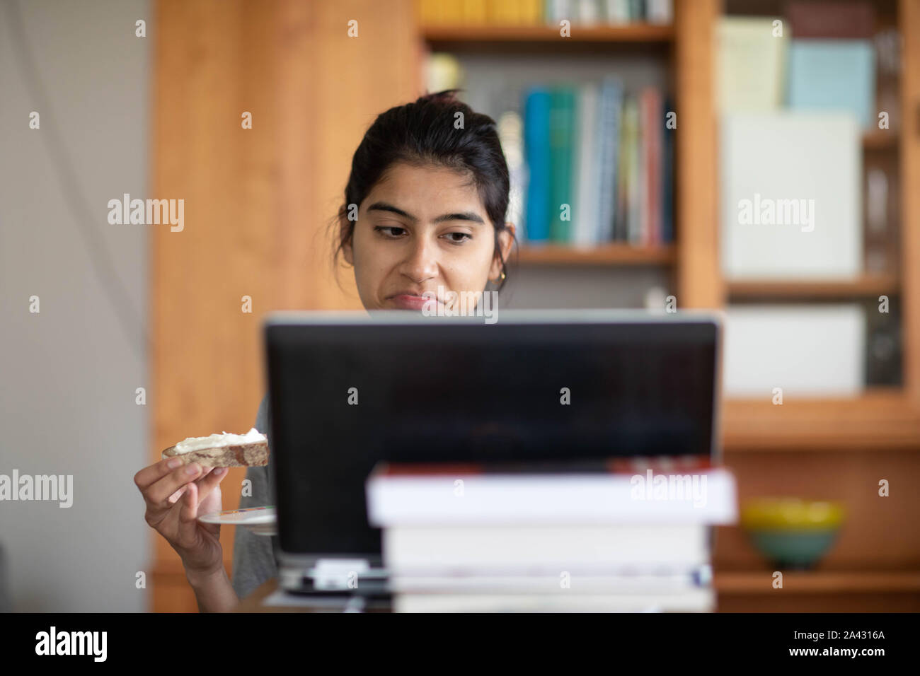 Indian student eating hi-res stock photography and images - Alamy