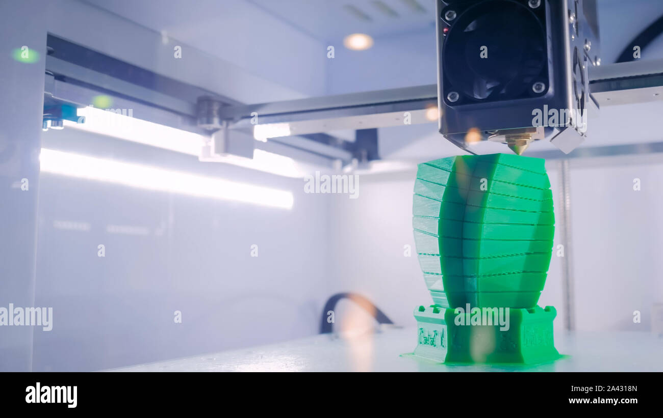 Three dimensional printing machine prints physical 3D model Stock Photo ...