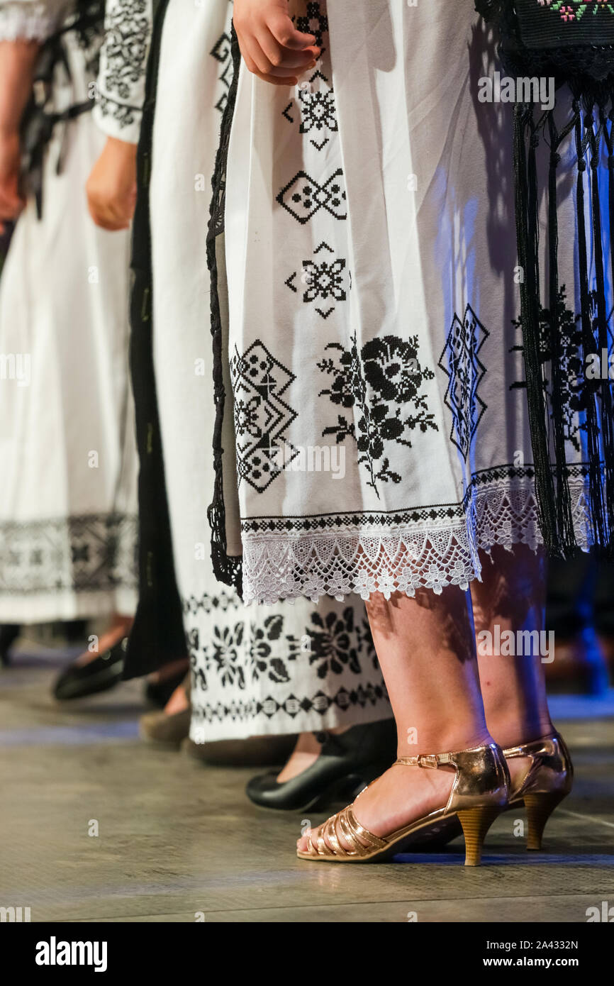 Close up of legs of young Romanian female dancers in traditional ...