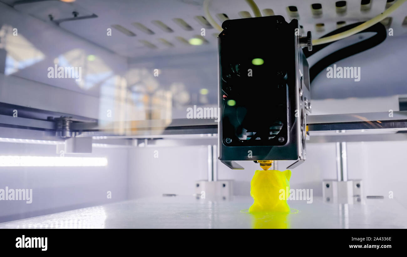 Automatic 3D printer machine working at modern technology exhibition ...