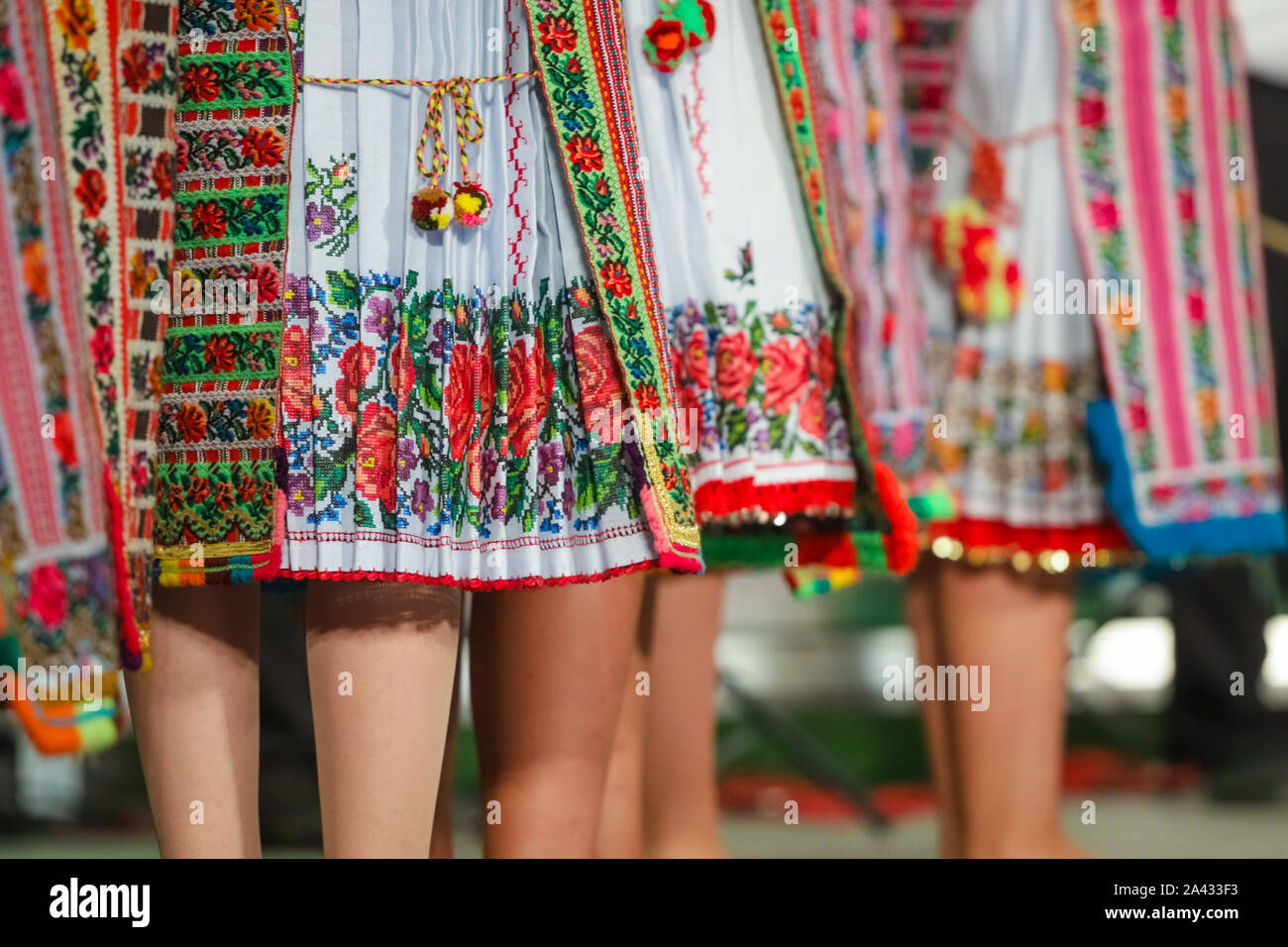 Close up of legs of young Romanian female dancers in traditional ...