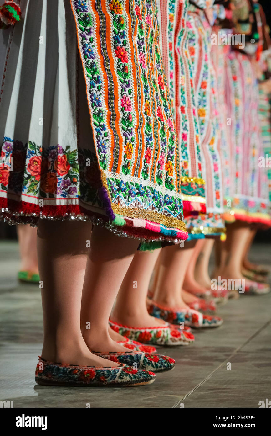 Close up of legs of young Romanian female dancers in traditional ...