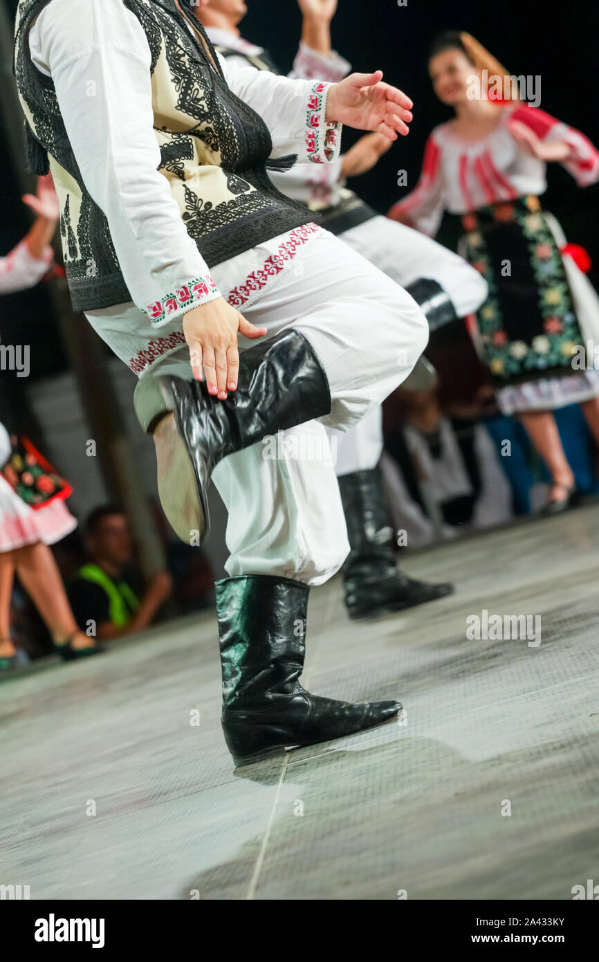 Close up of legs of young Romanian male dancer in traditional folkloric ...