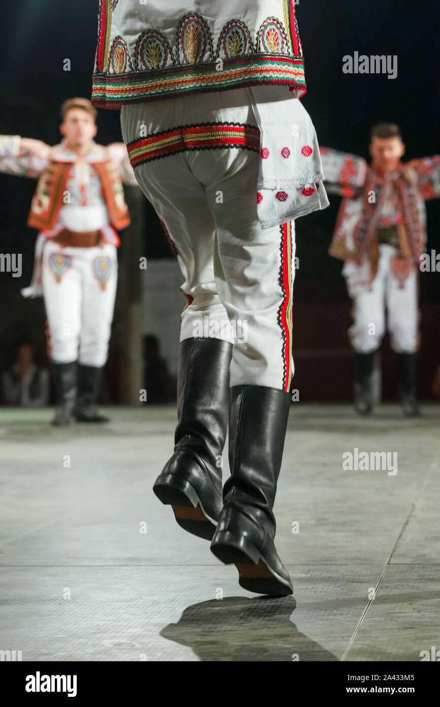 Close up of legs of young Romanian male dancer in traditional folkloric ...