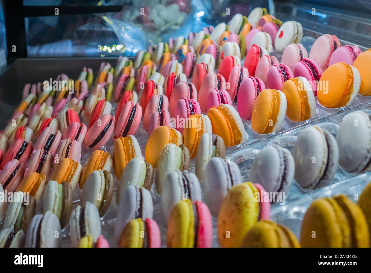 Colorful macarons for sale on counter of candy shop Stock Photo - Alamy