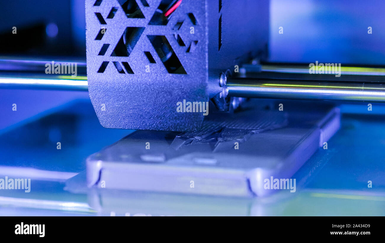 Modern 3D printer machine printing plastic model Stock Photo - Alamy