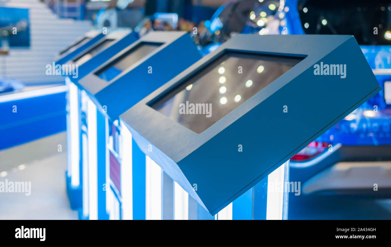 Electronic kiosks with touchscreen displays at modern trade show or ...