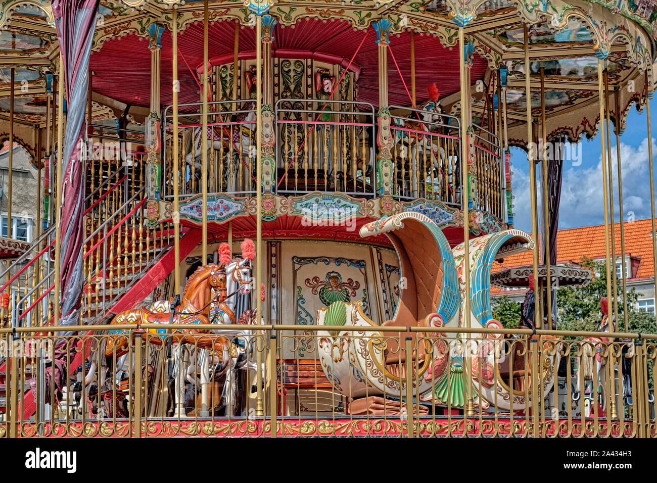 Richly colourful decorated Merry Go Round double decker children ...