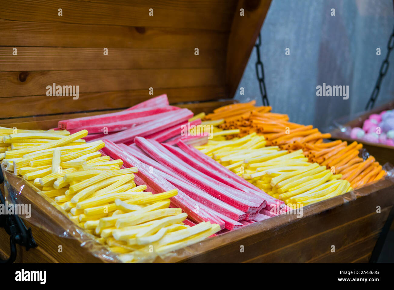 Assortment of colorful delicious marmalade candies for sale on counter ...