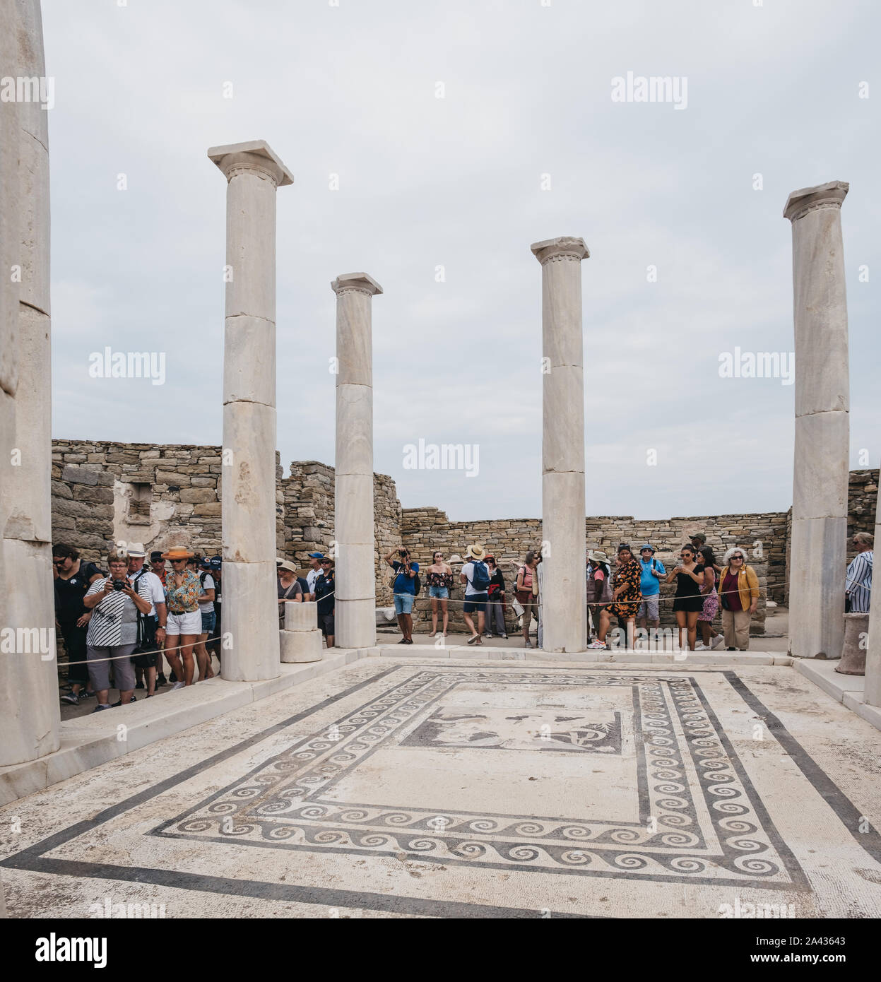 Delos, Greece - September 20, 2019: People walking around House of ...