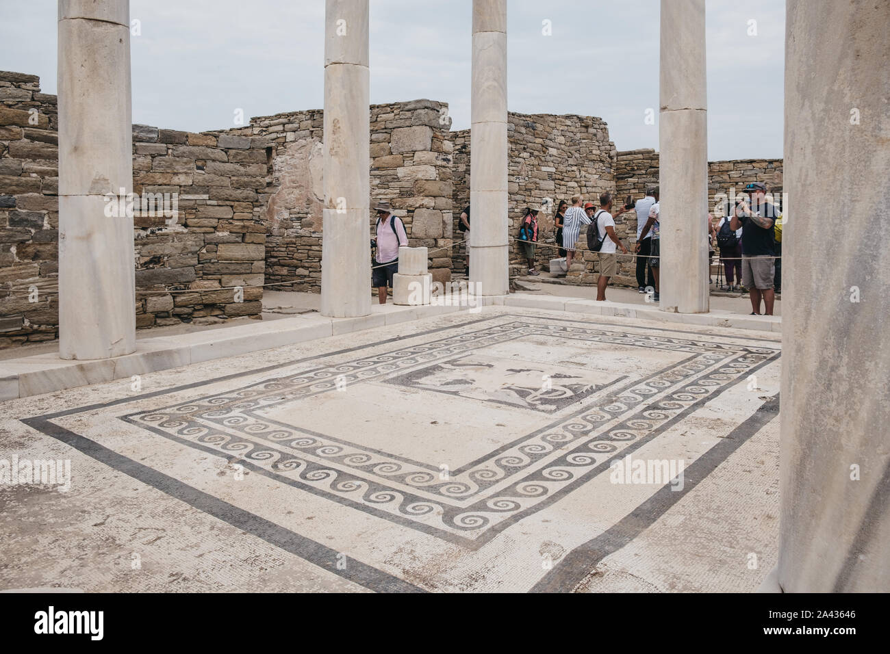 Delos, Greece - September 20, 2019: People walking around House of ...
