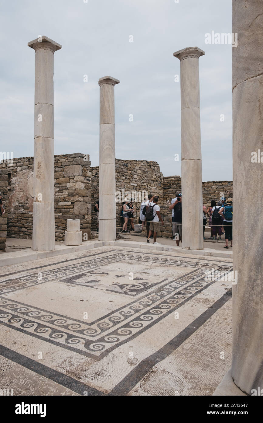 Delos, Greece - September 20, 2019: People walking around House of ...