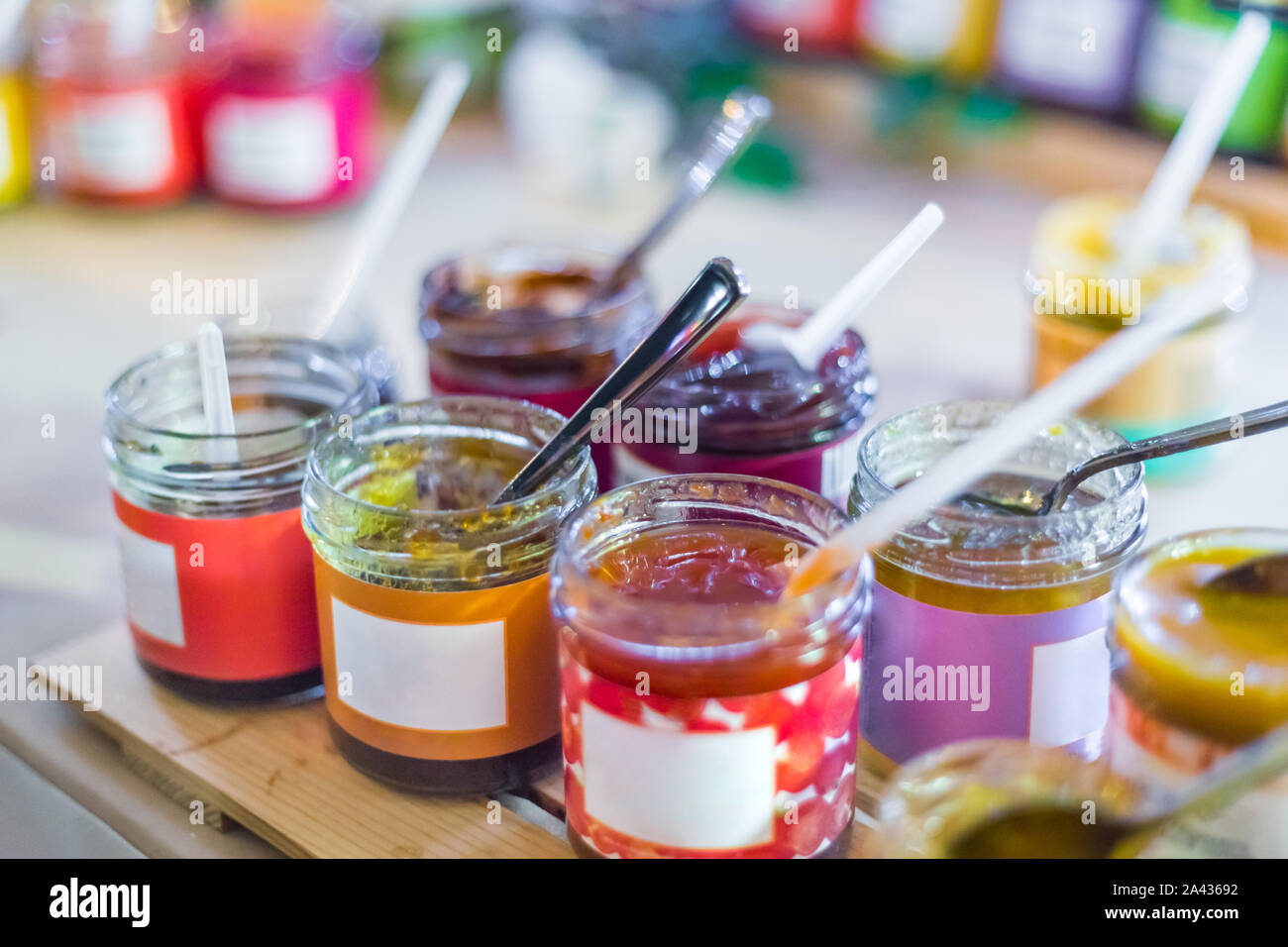 Delicious colorful jam, jelly or confiture in little glass jar Stock ...