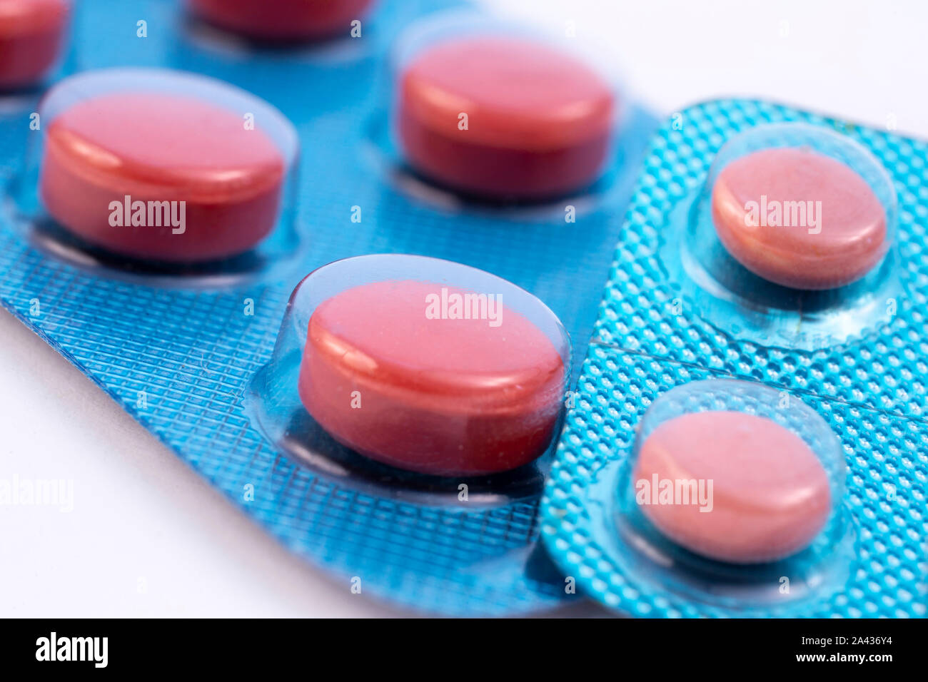 Red pills in blue plastic pack - blister. Global pharmaceutical ...