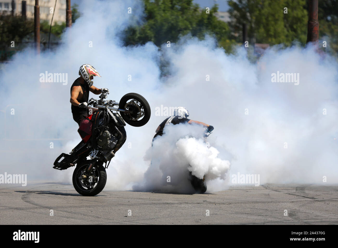 Sofia, Bulgaria - 18 August 2019: Two motorbikes burn wheels on a race ...