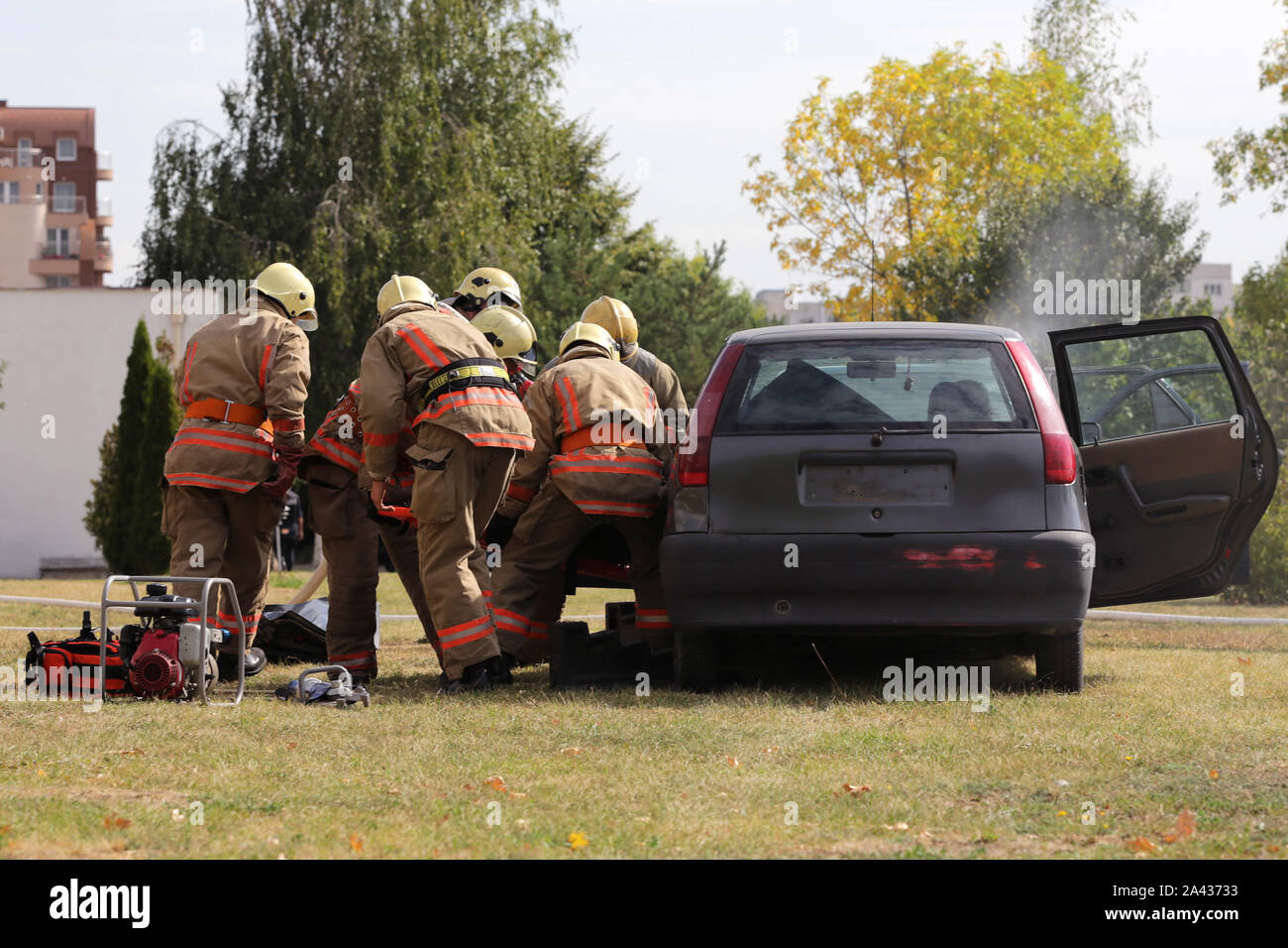 Firefighters participate in a training where they extinguish fire from ...