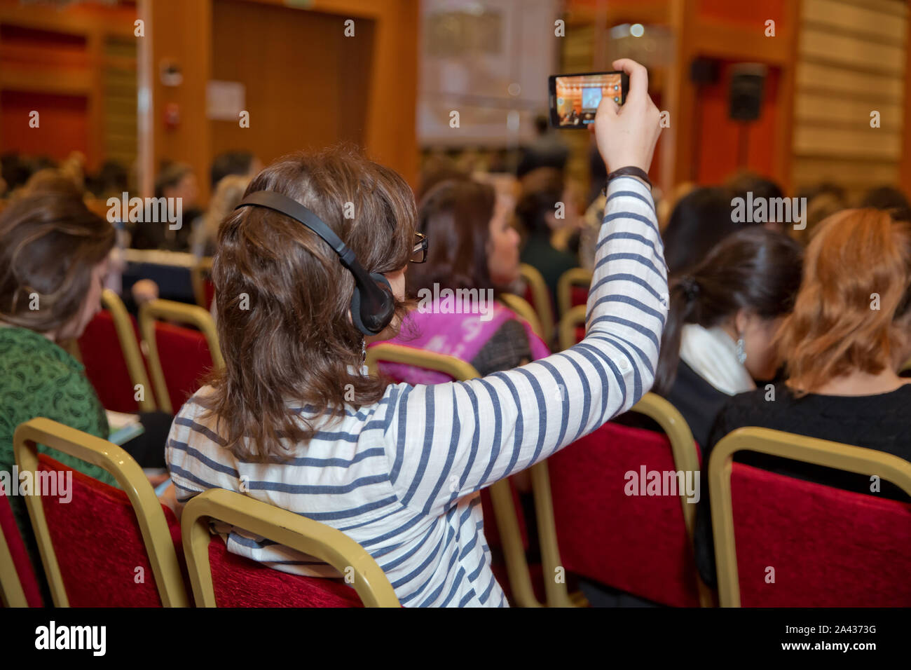 Unrecognizable business people using headphones hi-res stock ...