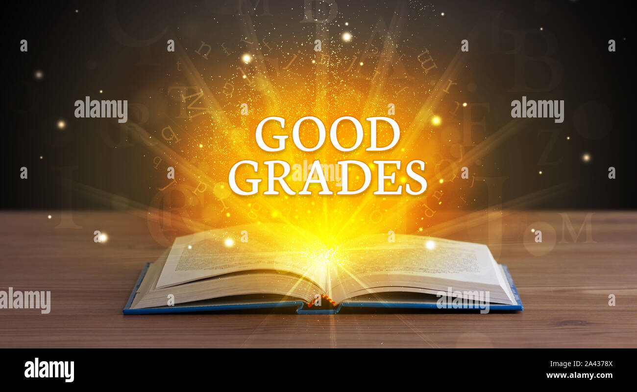 GOOD GRADES inscription coming out from an open book, educational ...