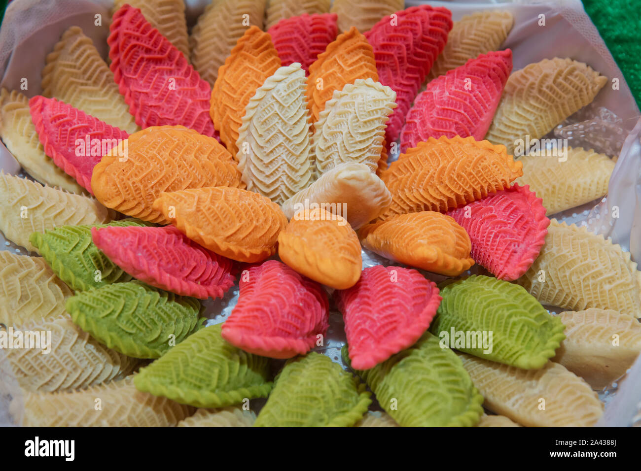 Colorfull Shekerbura with nuts and honey on wooden table background ...