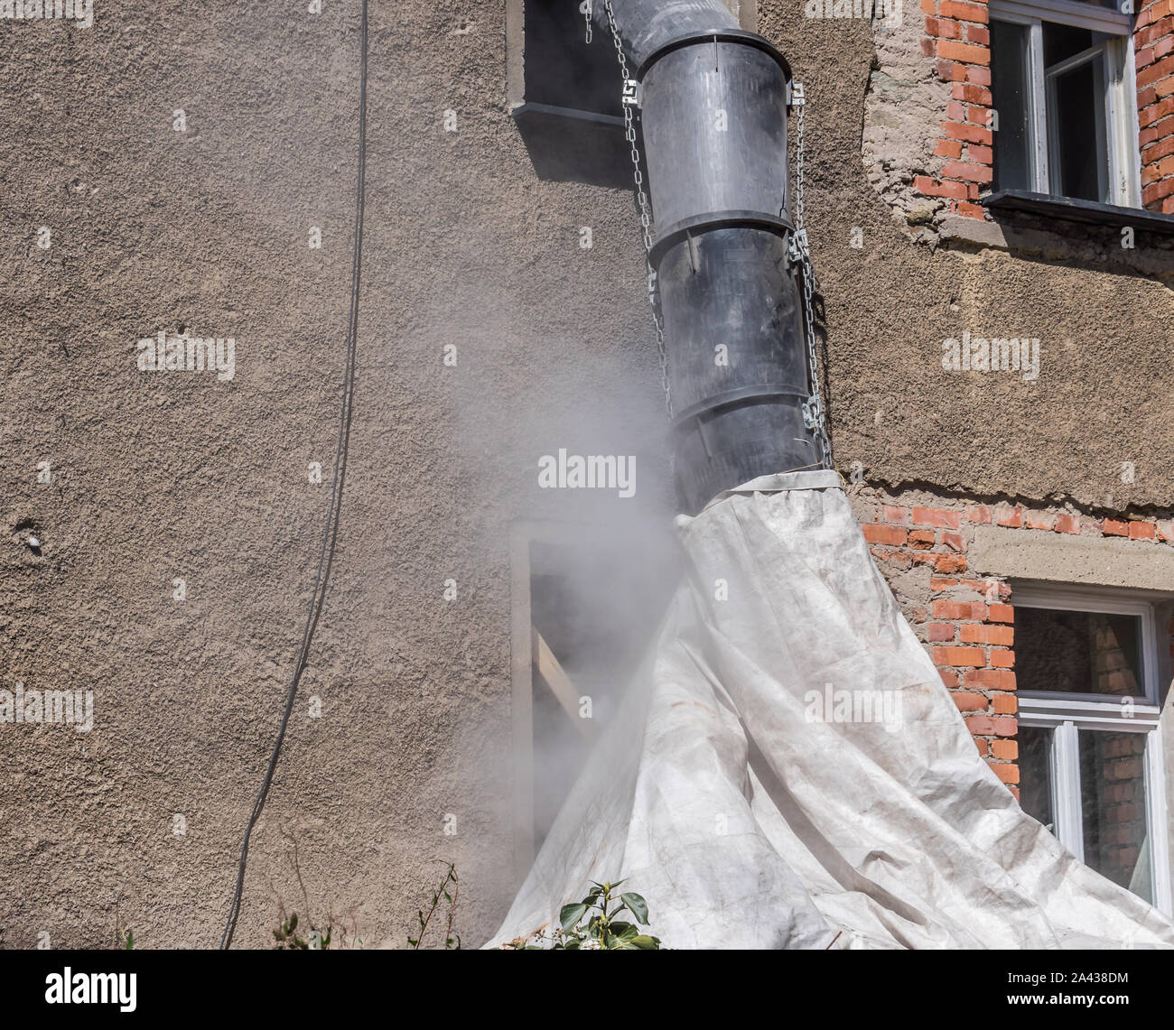 Rubble chute on a construction site with dirt Stock Photo - Alamy