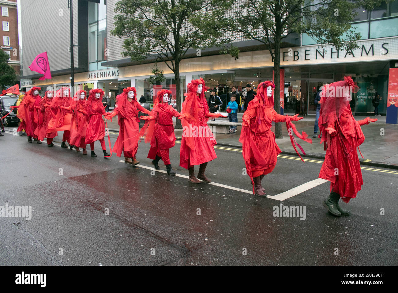 London, UK - 11 October 2019. The Red Rebel Brigade from Extinction ...