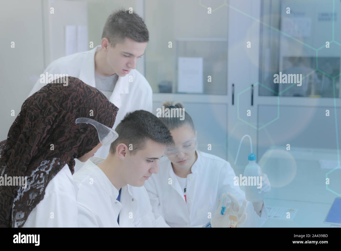 Group young people doing experiments hi-res stock photography and ...