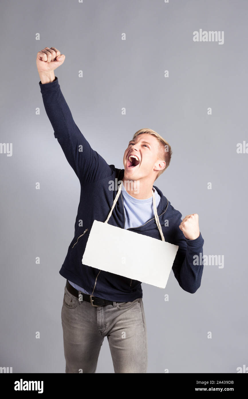 Happy successful man presenting empty signboard Stock Photo - Alamy