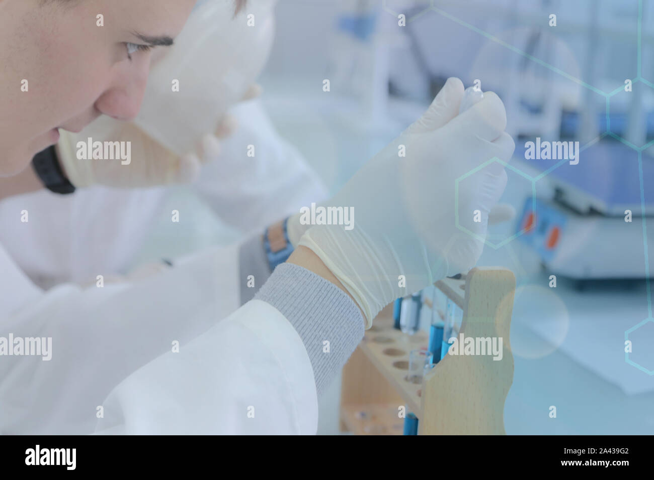 Young male scientist doing experiments in laboratory Stock Photo - Alamy