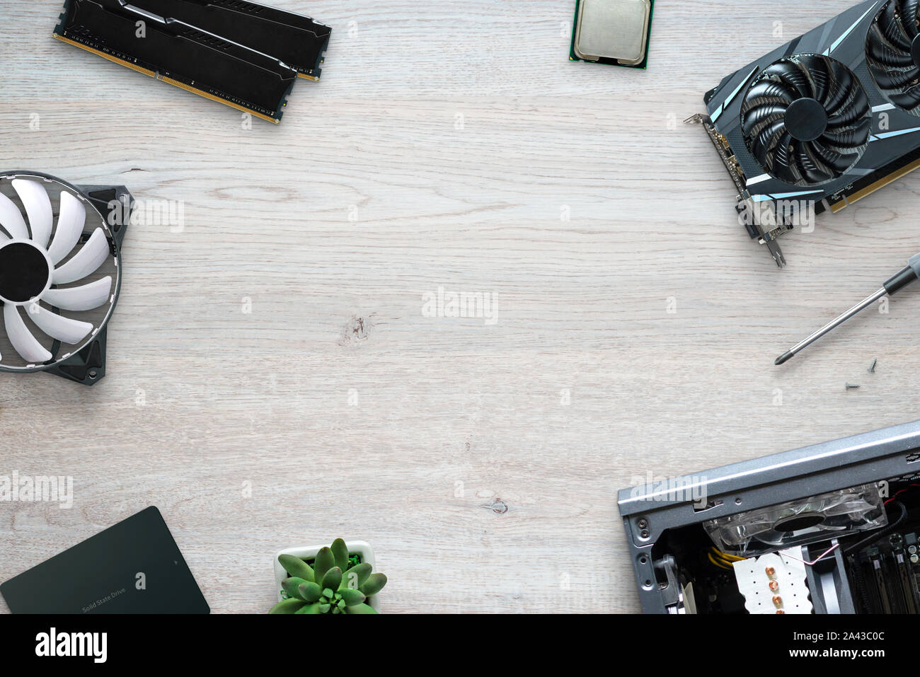 Computer assembly concept. Composition of computer parts on wooden desk ...